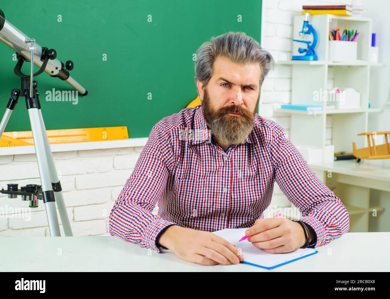 Back to school. Learning, education. Teacher prepares lesson in ...