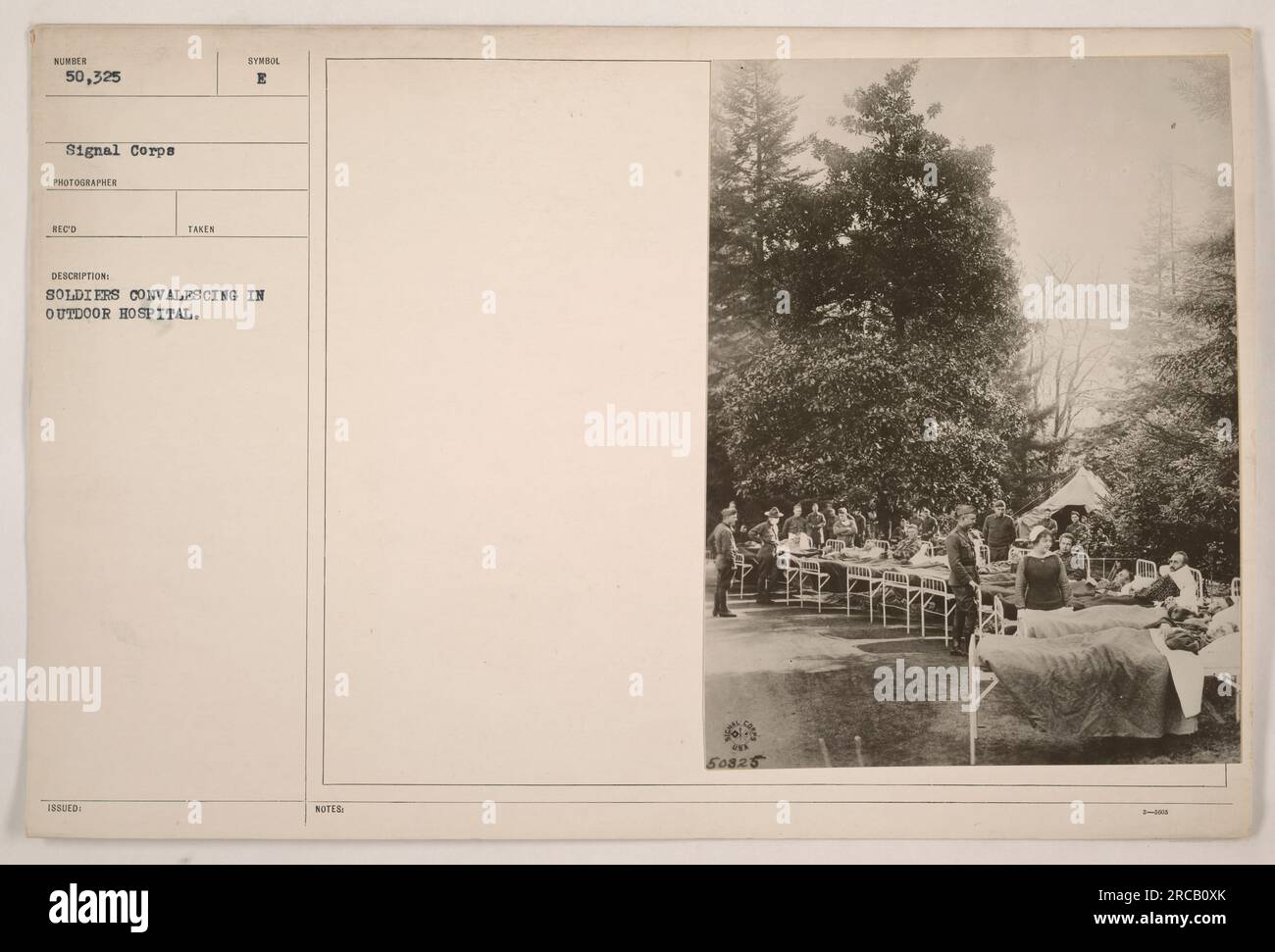 Soldiers recovering from injuries at an outdoor hospital. The ...