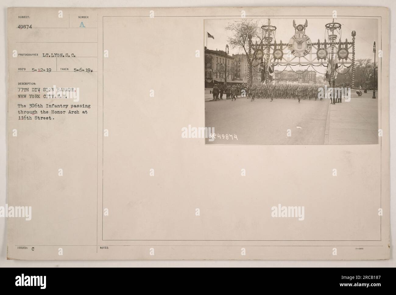 "The 306th Infantry of the 77th Division parades through the Honor Arch ...