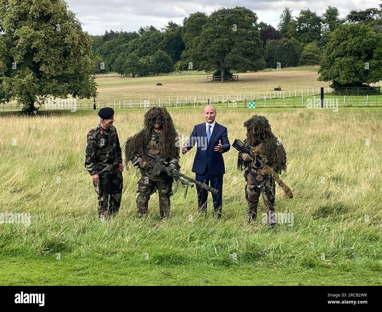 Tánaiste and Minister for Defence Micheal Martin (centre-right) and ...