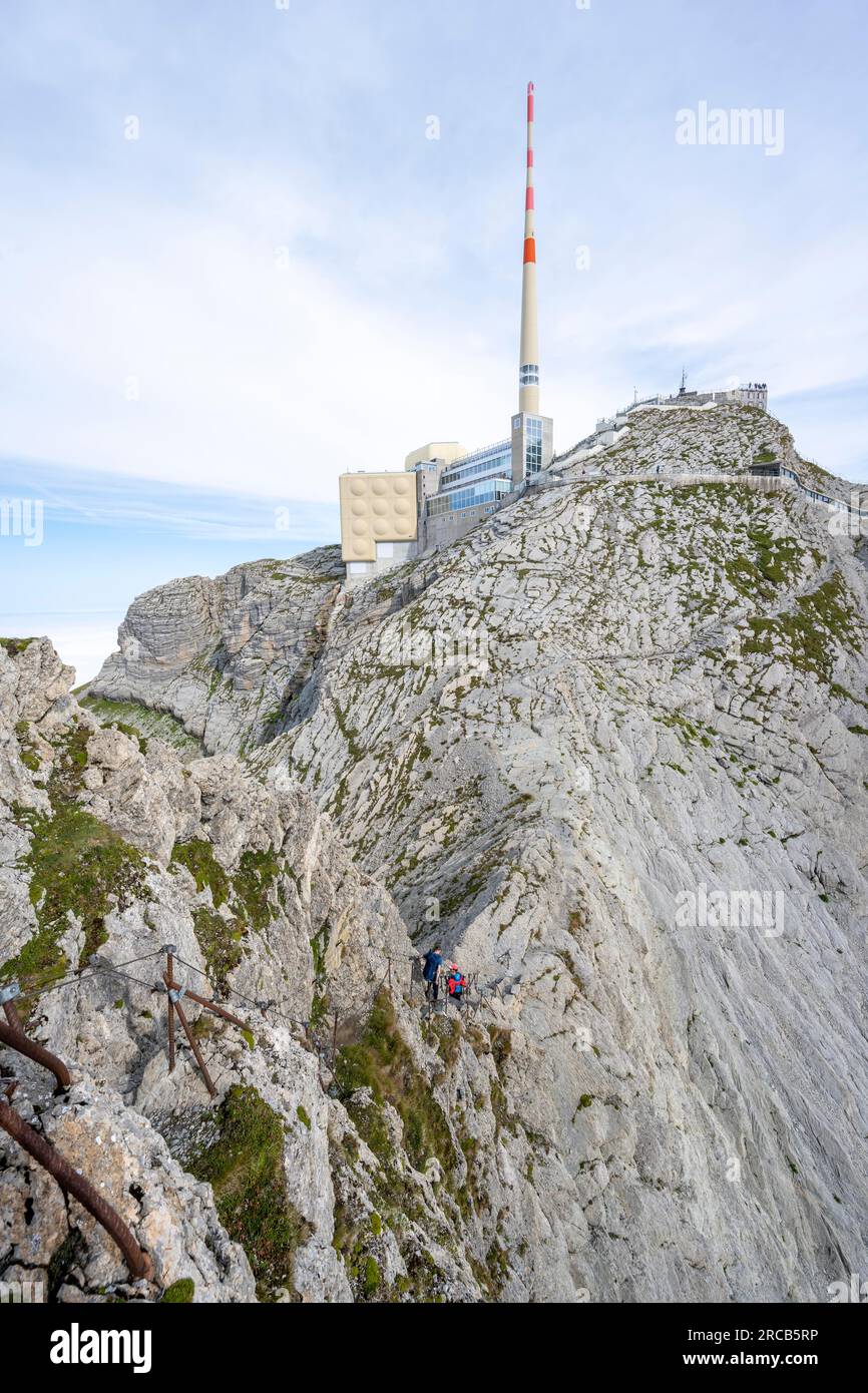 Climbers on a narrow ridge path, climbing Saentis over the Lisen ridge ...