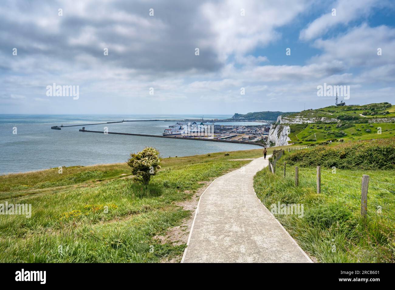 Footpath along the chalk cliffs of Dover with view to the ferry port ...