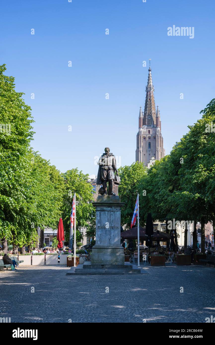 Simon Steviplein with the statue of the Flemish mathematician and ...