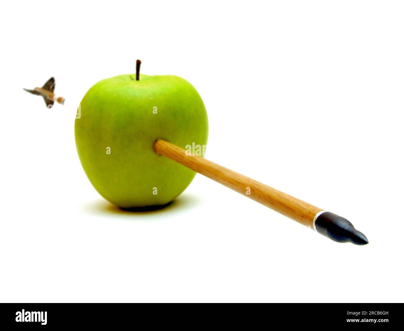 Arrow in an apple Stock Photo - Alamy