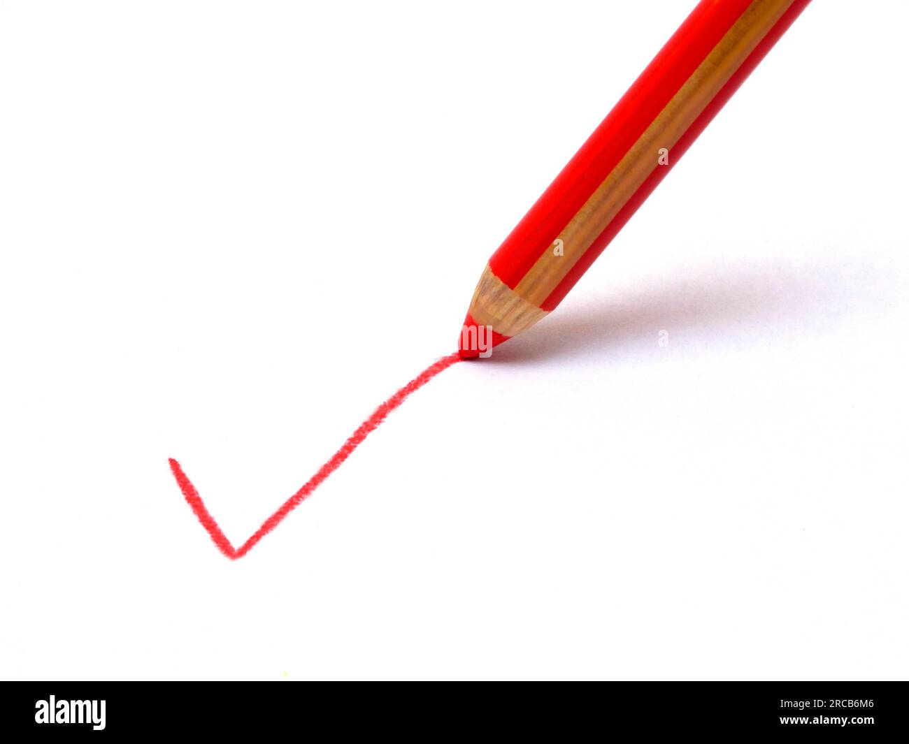 A tick with a red pencil Stock Photo - Alamy