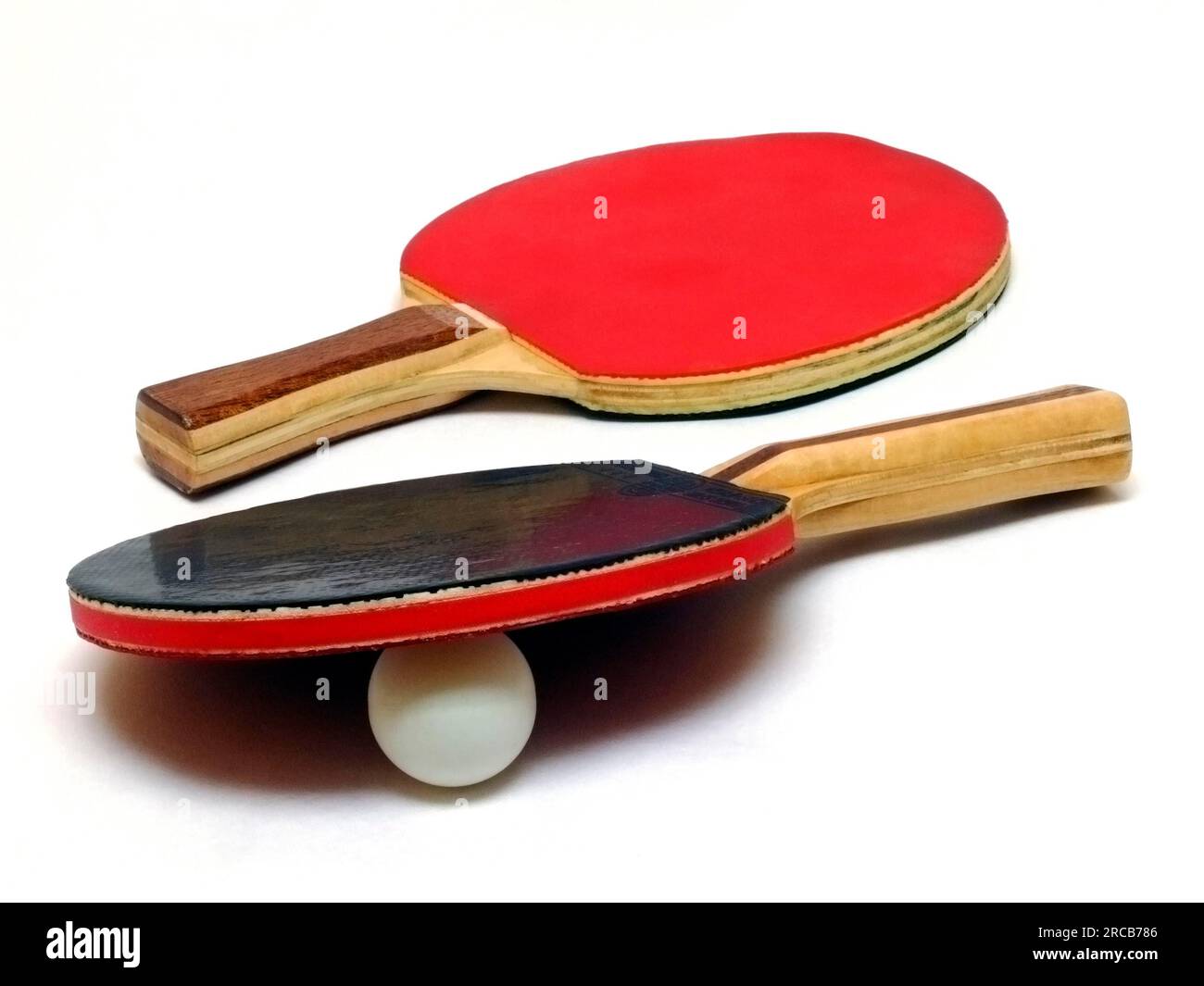 Two table tennis bats and a ball Stock Photo - Alamy
