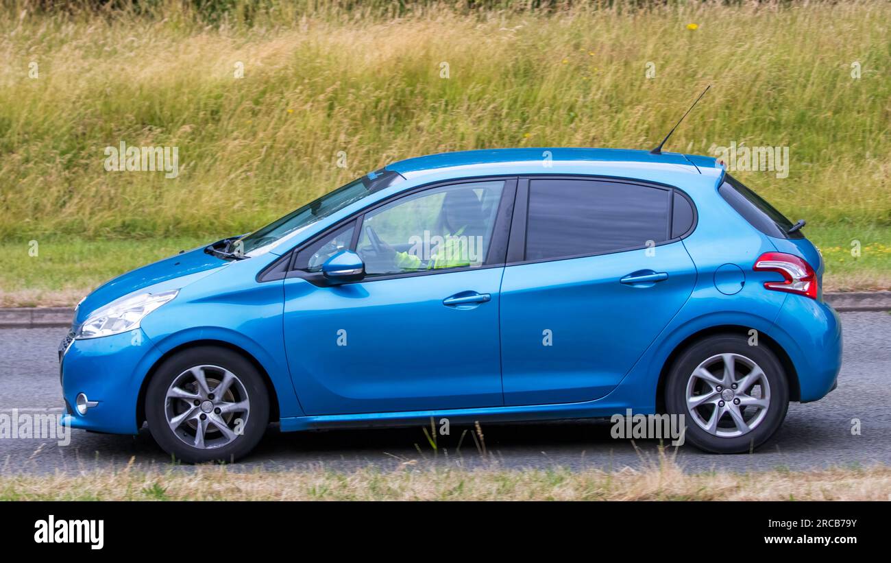 Milton Keynes,UK - July 9th 2023: 2013 blue diesel engine PEUGEOT 208 ...