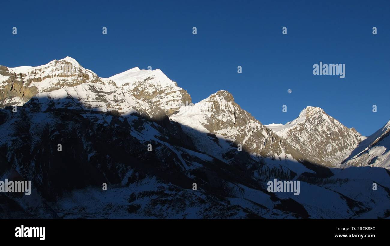 Full moon over snow capped hi-res stock photography and images - Alamy
