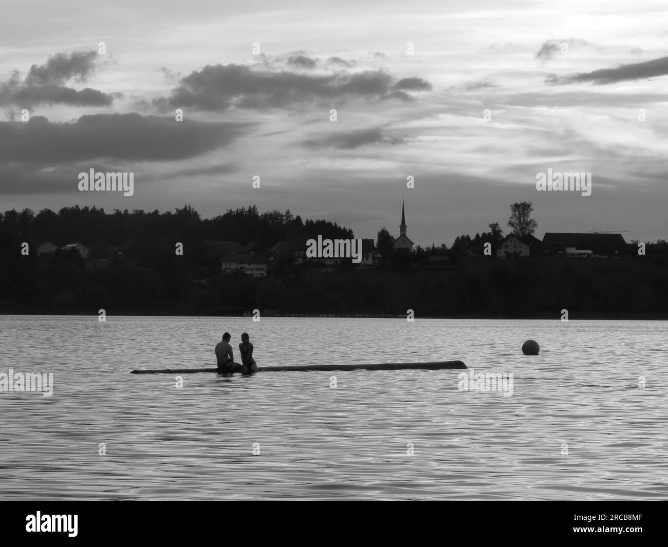 Evening scene at a Swiss lake Stock Photo - Alamy