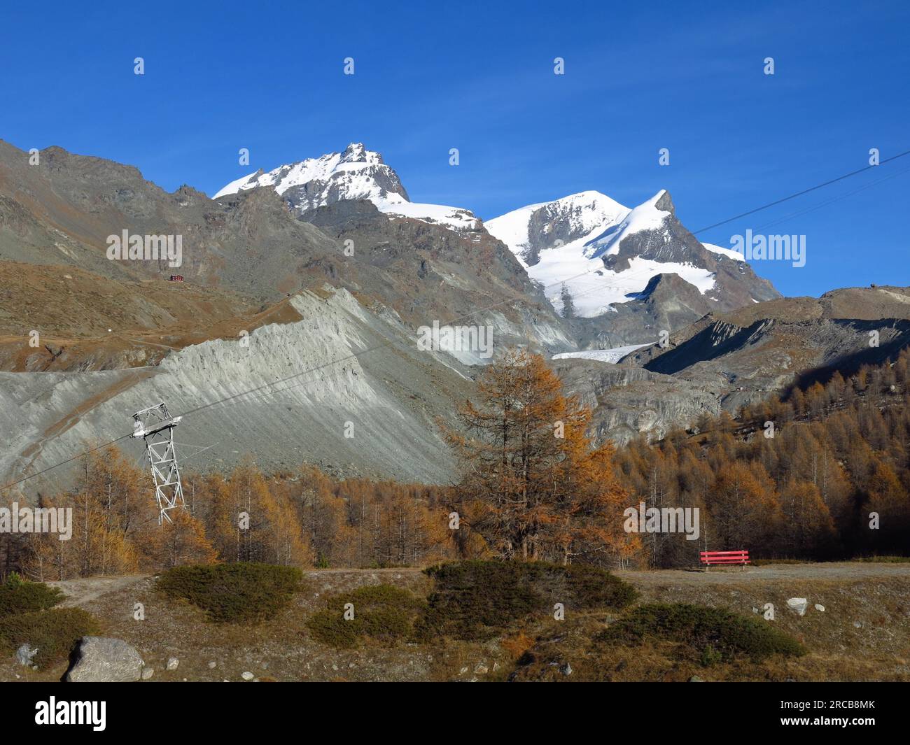 Autumn scene in Zermatt, colorful larch forest and snow capped ...