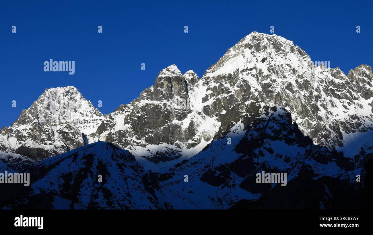 Snow covered peak of Phari Lapcha Stock Photo - Alamy