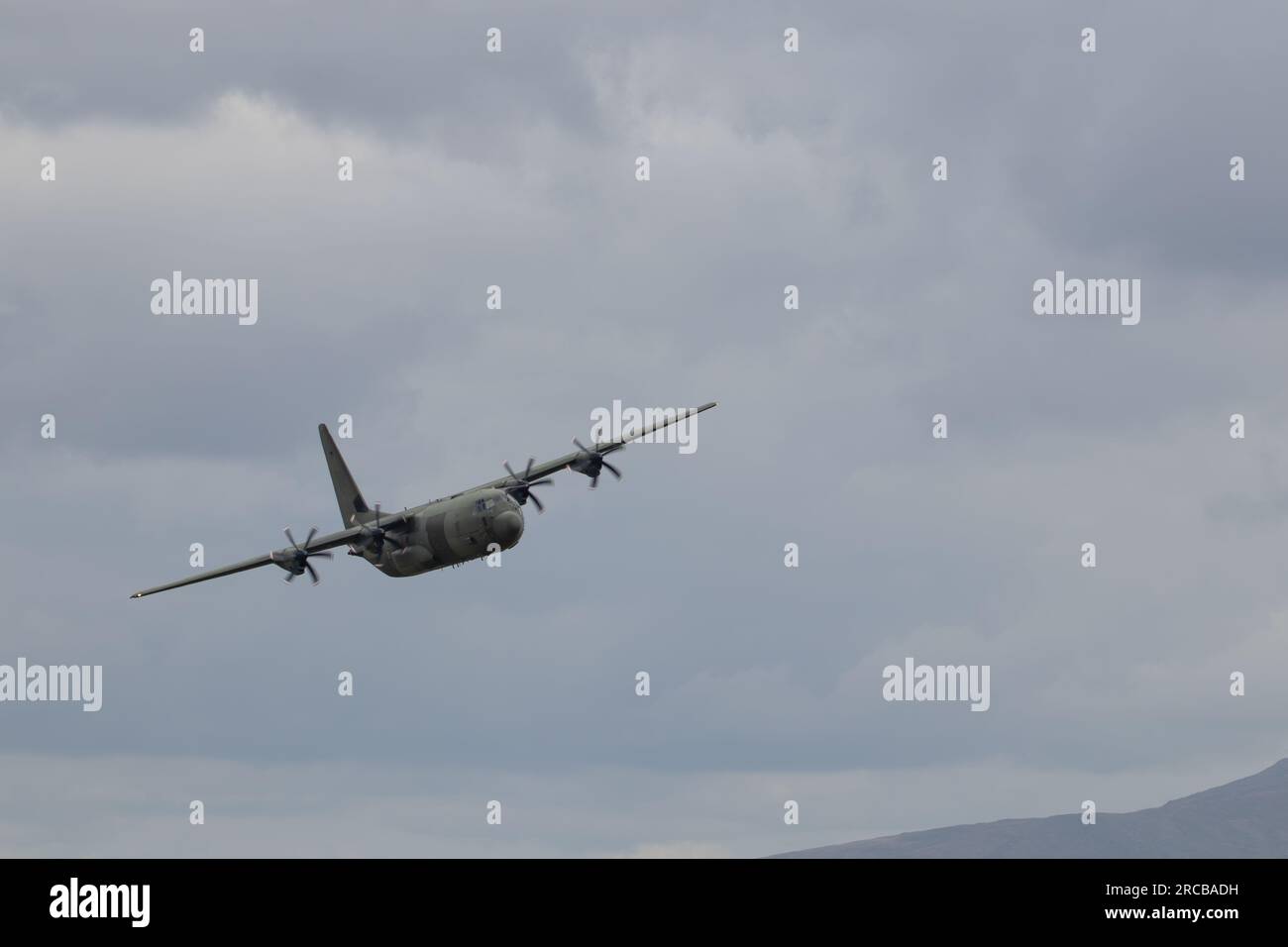Hercules passing through Mach Loop Stock Photo - Alamy