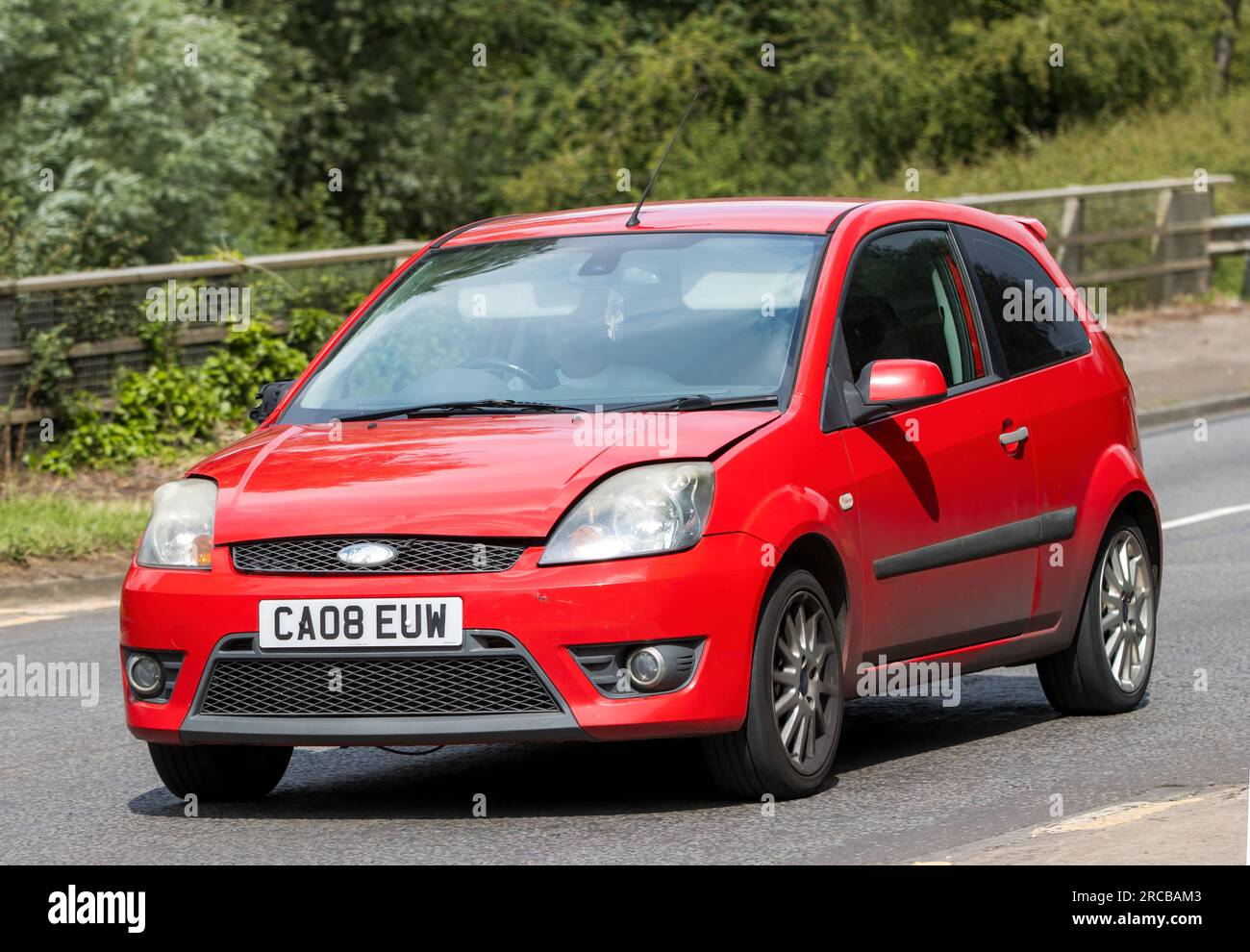 Milton Keynes,UK - July 13th 2023: 2008,red FORD FIESTA car driving on ...