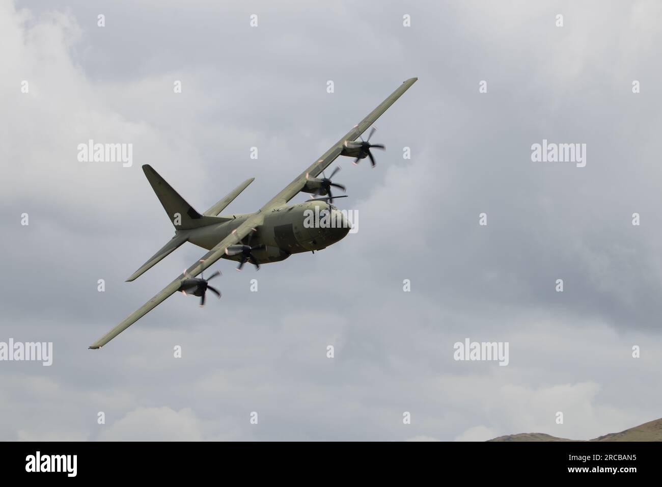 Hercules passing through Mach Loop Stock Photo - Alamy