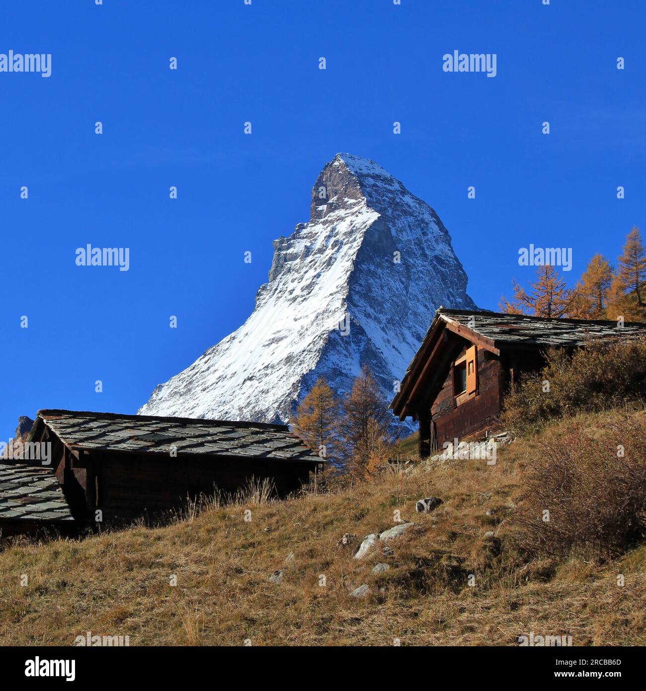 Scene in Zermatt. Famous mountain Matterhorn. Old timber huts with ...