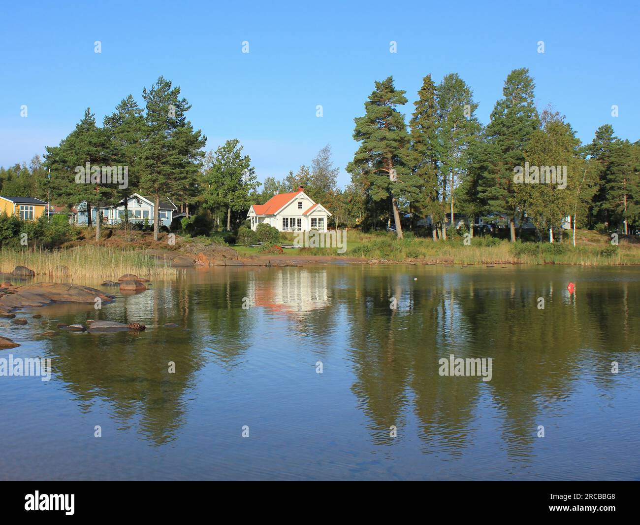 Trees and house at the shore of Lake Vanern Stock Photo - Alamy
