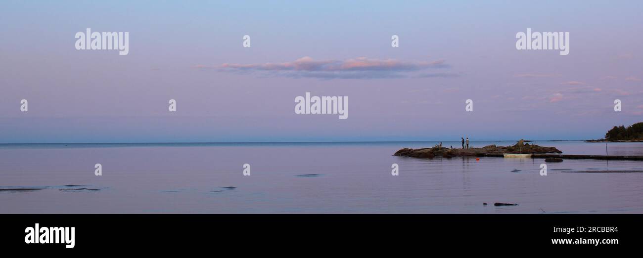 Romantic sunset scene at the shore of Lake Vanern, Sweden Stock Photo ...