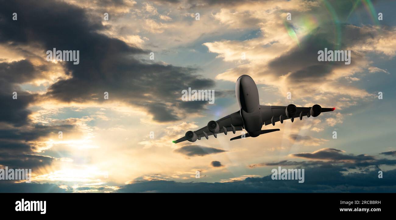 Passenger commercial aircraft flying above the clouds in sunset light ...