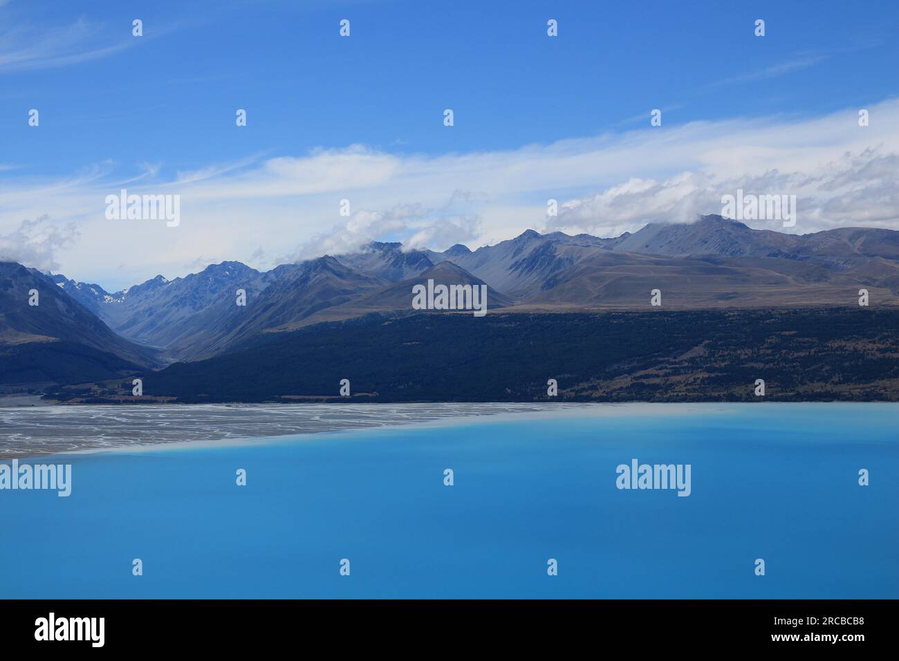Mountain range and river Delta at the shore of Lake Pukaki Stock Photo ...