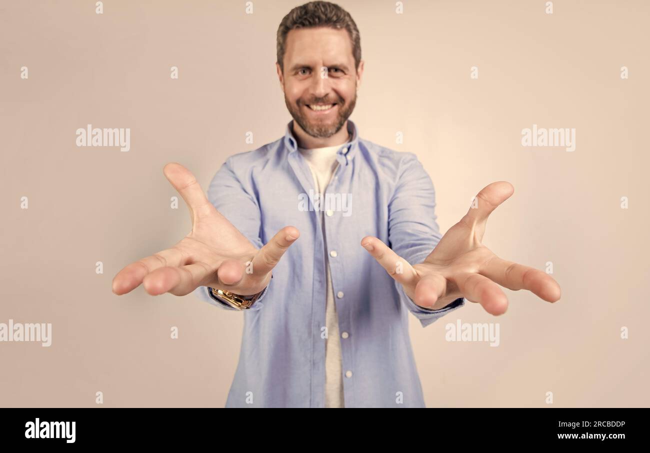 grabbing hands with grab gesture isolated on grey background. grabbing ...