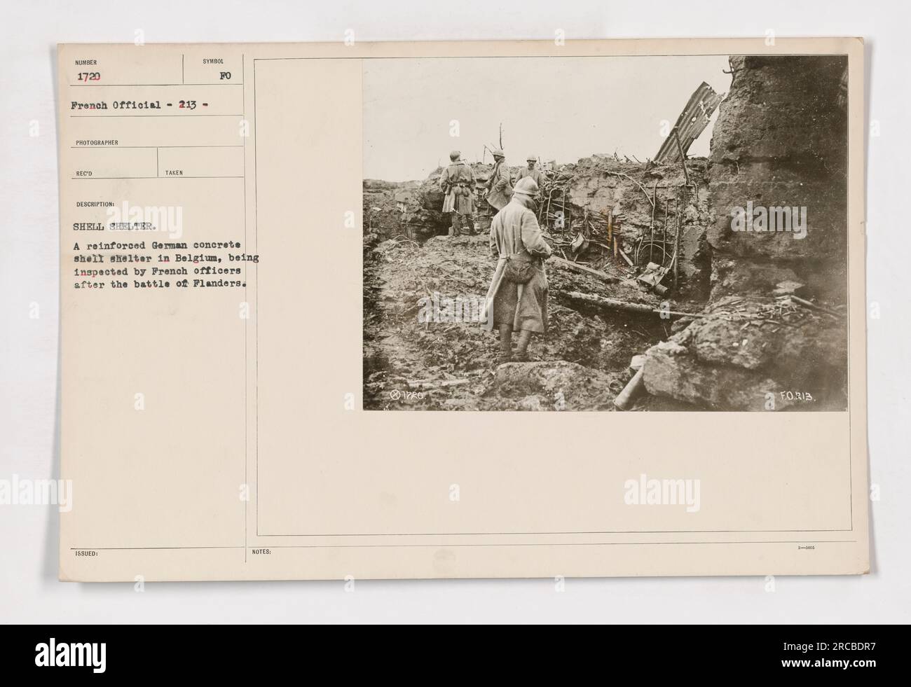 French officers inspect a reinforced German concrete shell shelter in ...