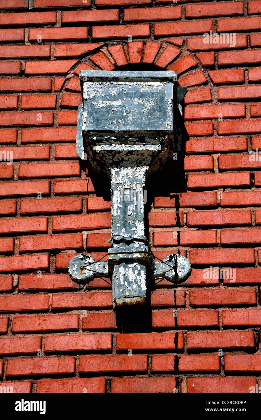 Partial drain pipe is mounted on the historic train depot in Strong ...
