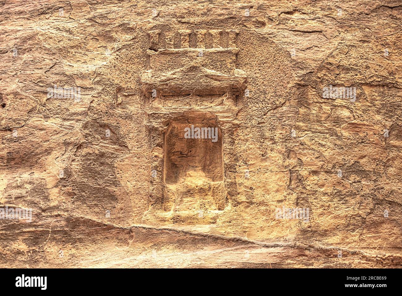 View of a wall with a man-made sandstone window. Petra, Jordan Stock ...