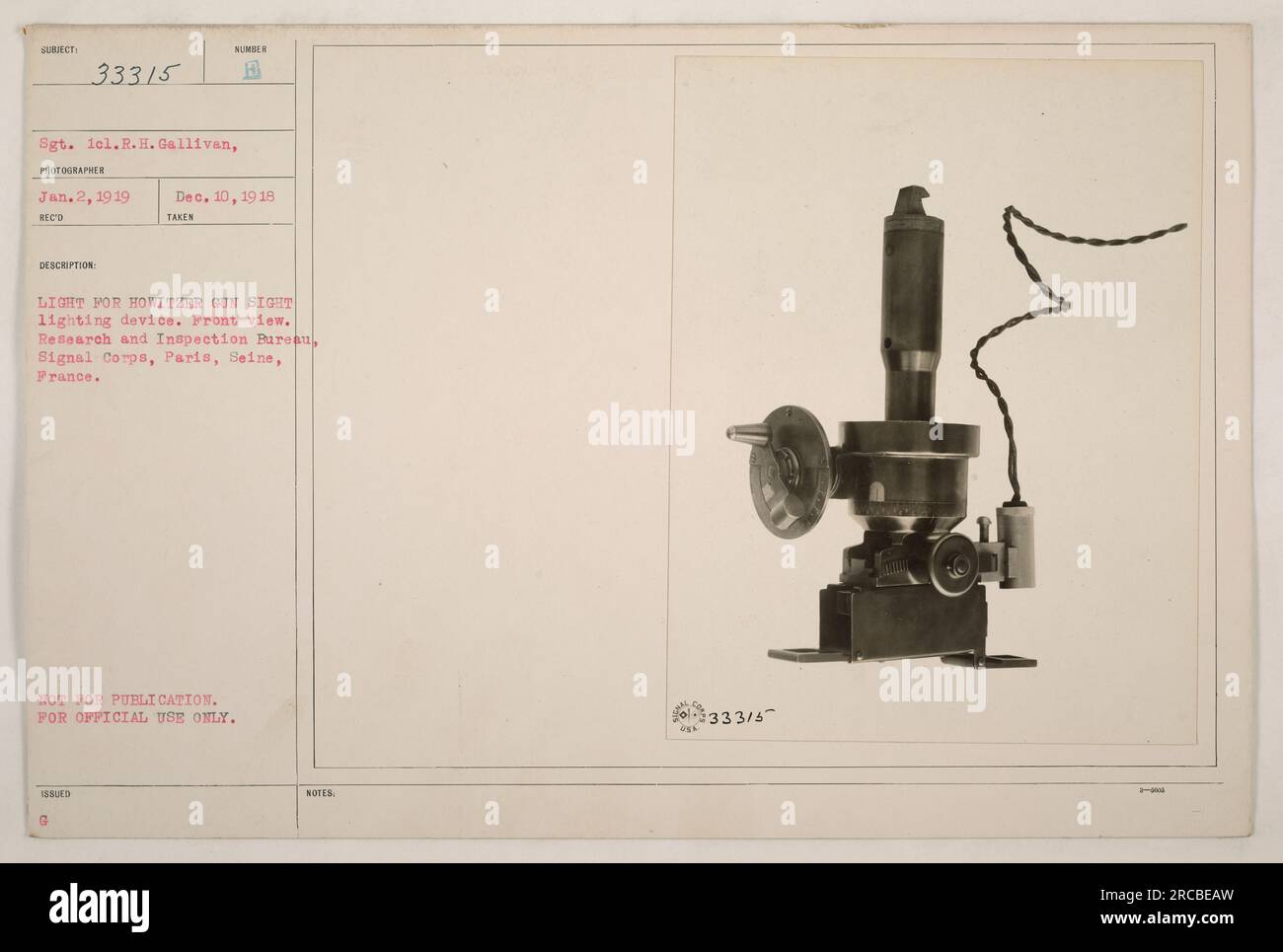 Sgt. 1cl. R.H. Gallivan captures an image of a lighting device issued ...