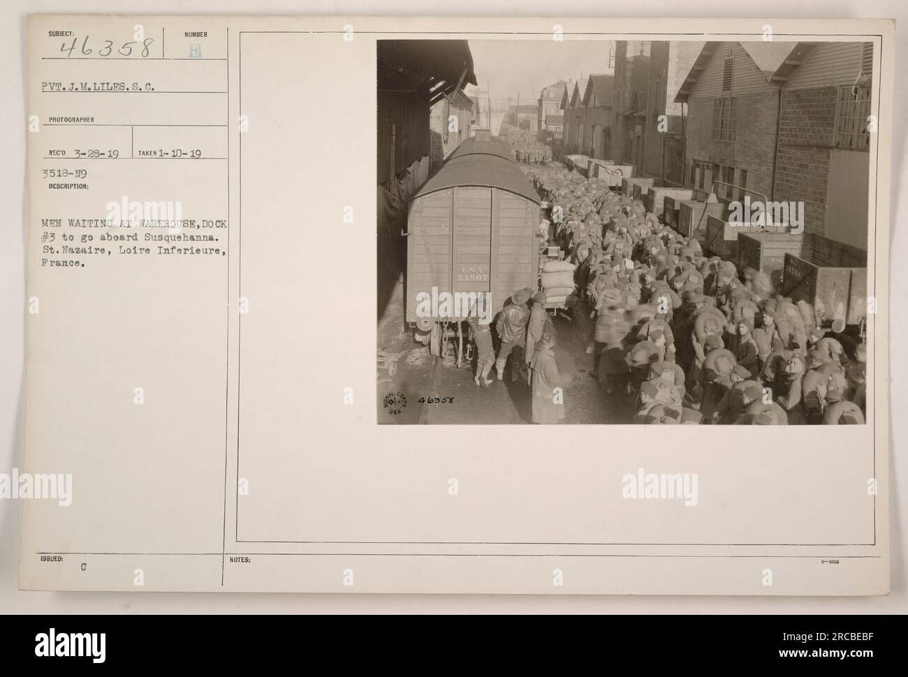 A group of men await their turn to board the USS Susquehanna at a ...