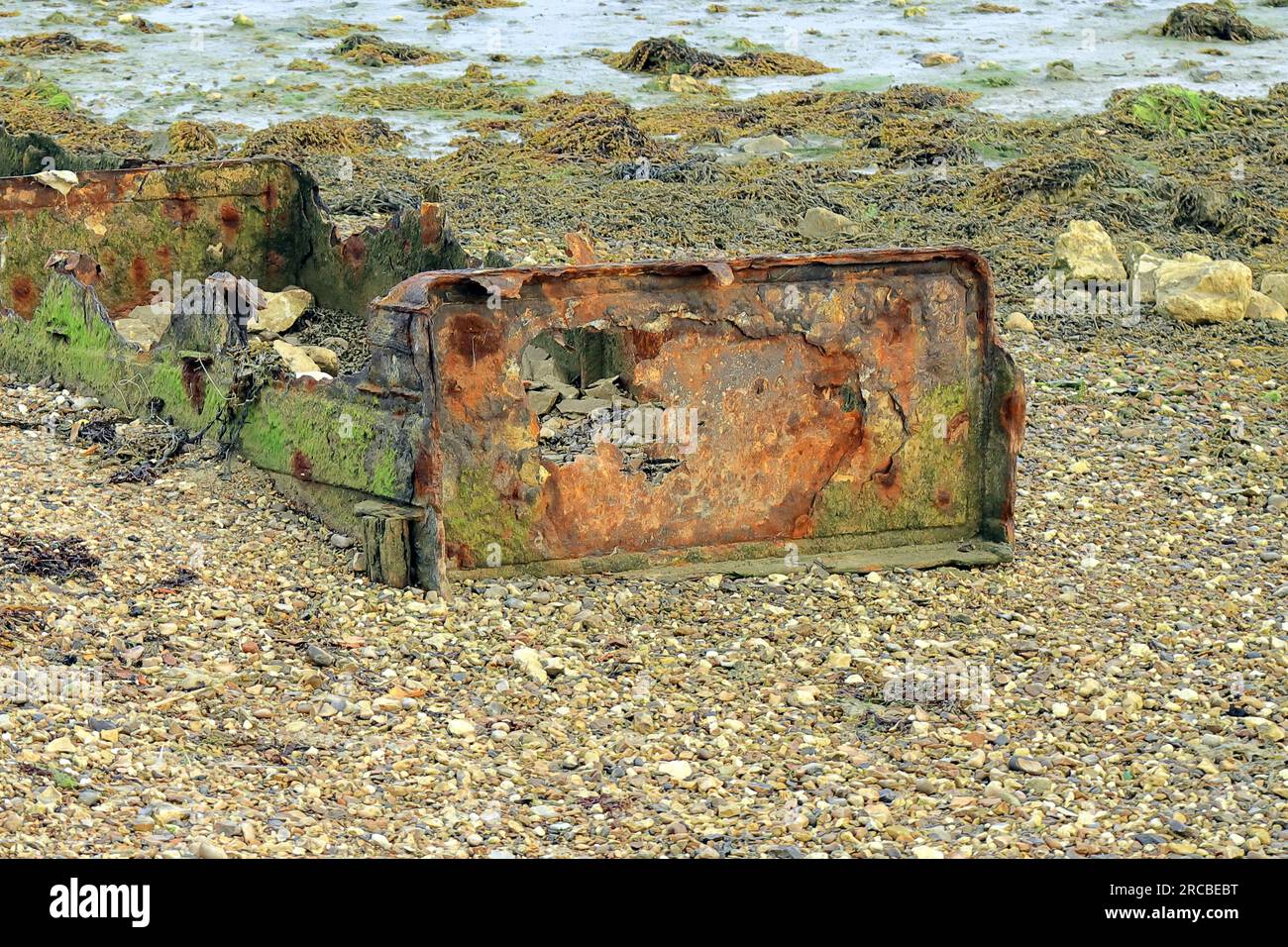 A large rusting metal form abandoned on the shore of Haslar Lake in ...