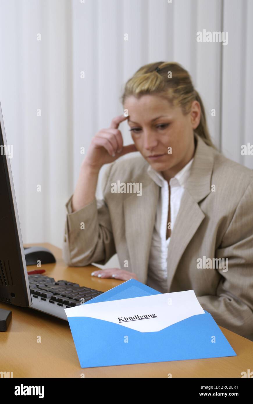 Woman received notice at work, blue letter Stock Photo - Alamy