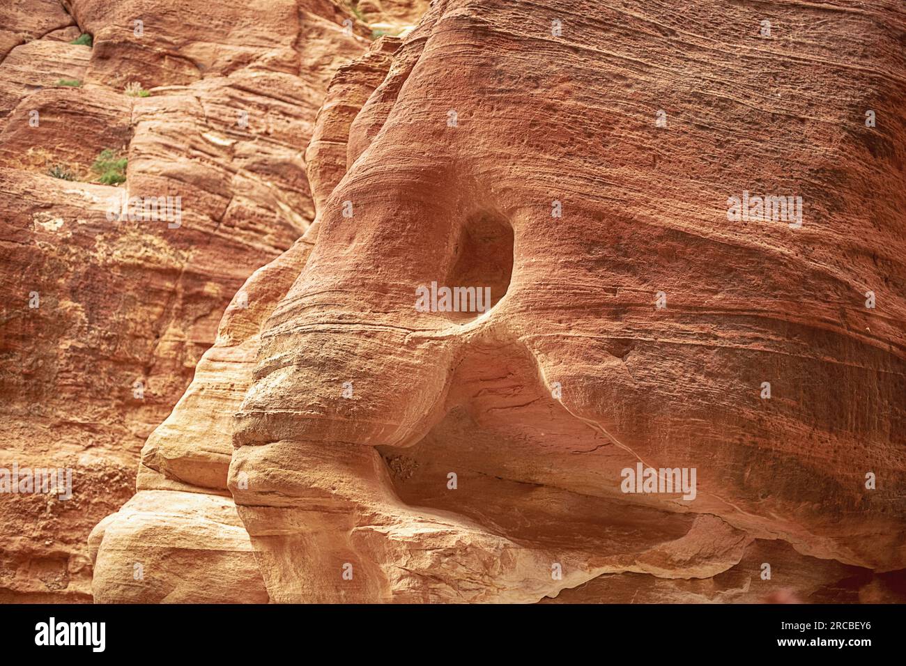 View of a wall with a man-made sandstone window. Petra, Jordan Stock ...