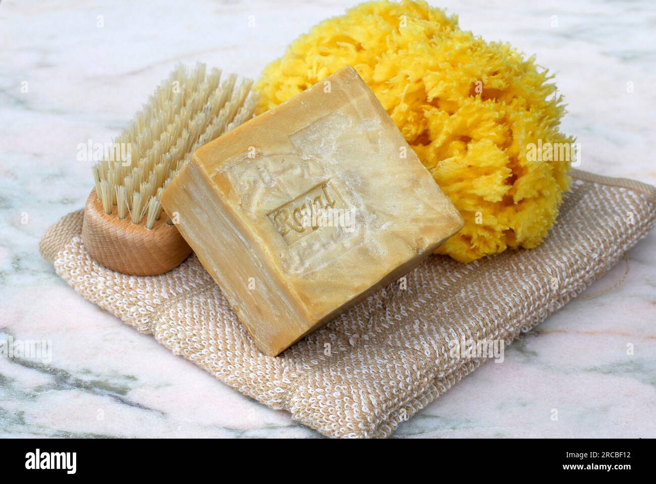 Olive soap, sponge and brush (Olea), olive soap, brush Stock Photo - Alamy