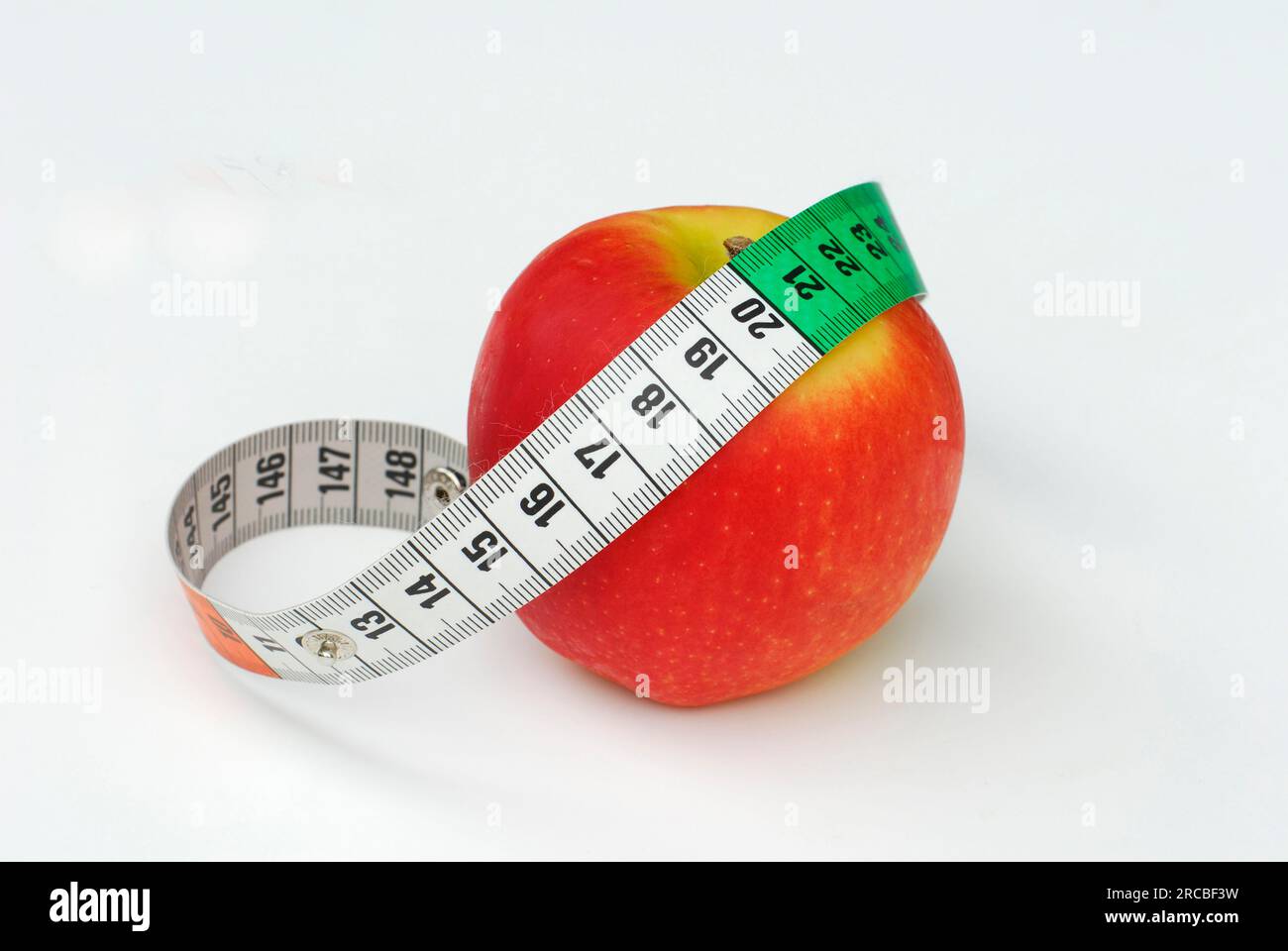 Apple with measuring tape Stock Photo - Alamy