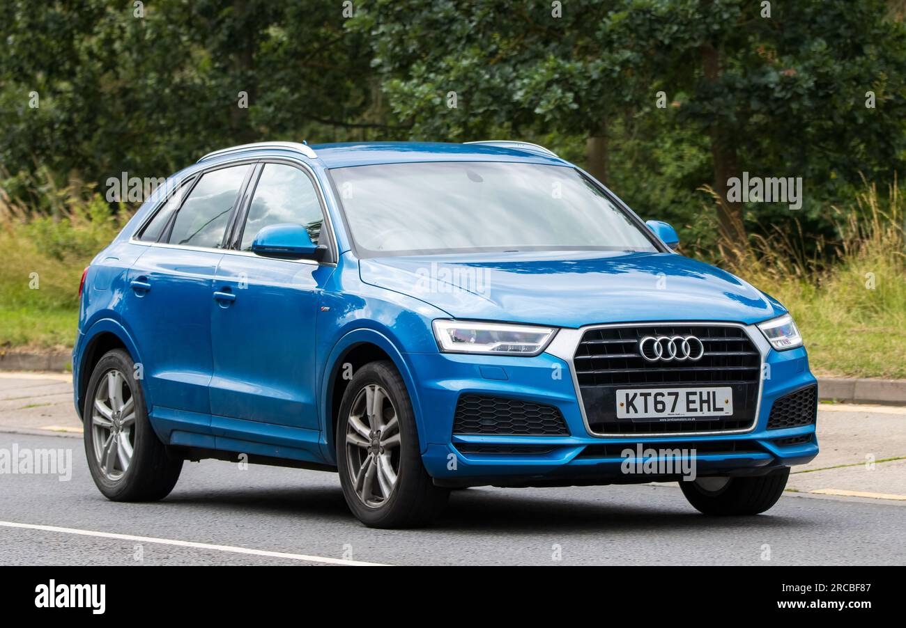 Milton Keynes,UK - July 13th 2023: 2018 blue AUDI Q3 car driving on an ...