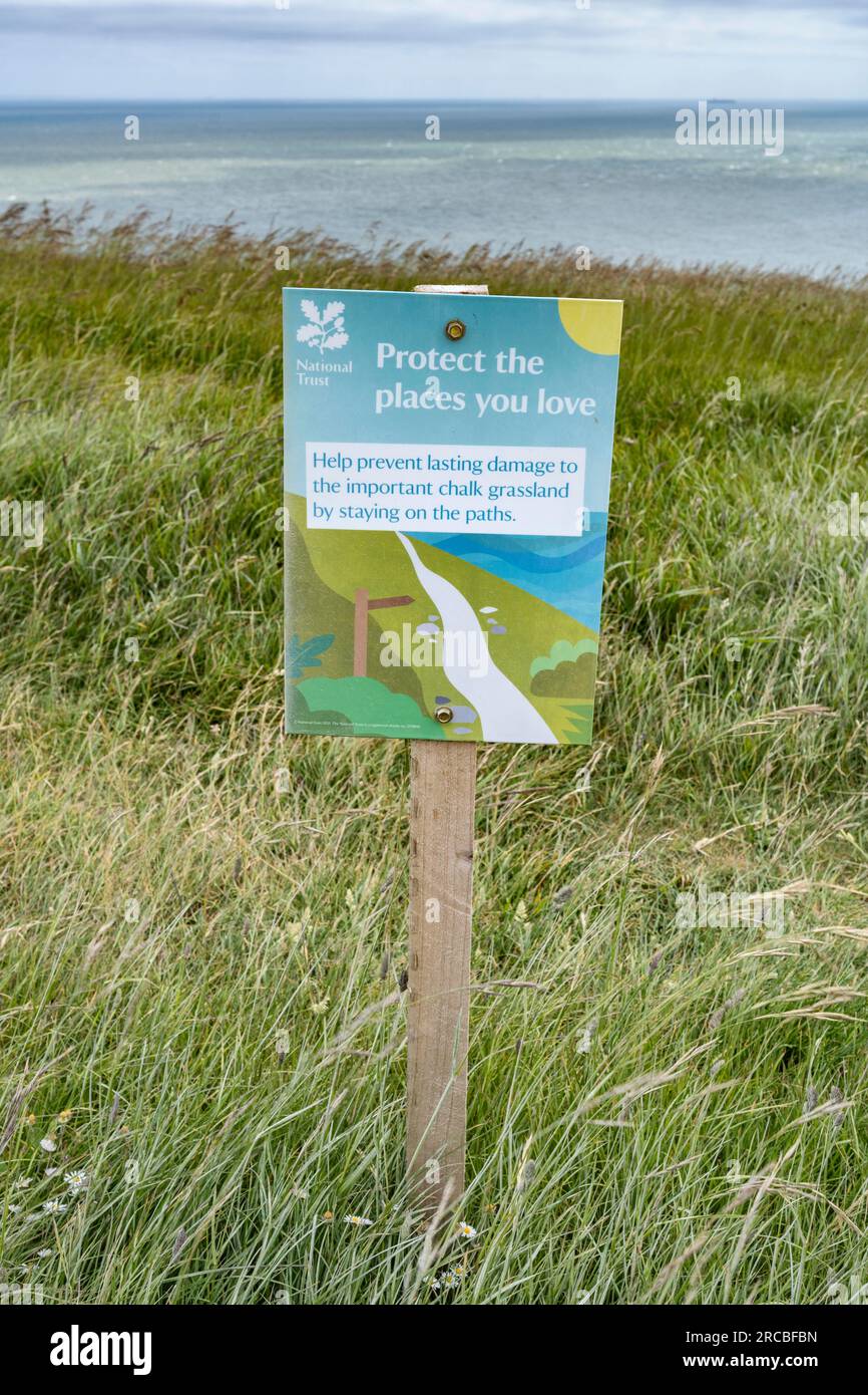 Conservation compliance sign on the footpath along the chalk cliffs of ...