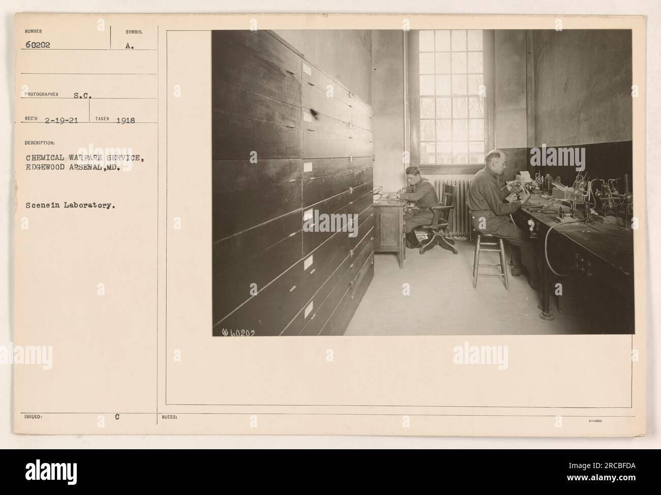 Chemical Warfare Service personnel working in the laboratory at ...