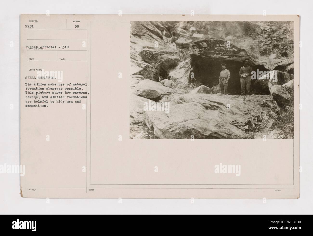 The photograph shows Allied soldiers utilizing natural formations such ...