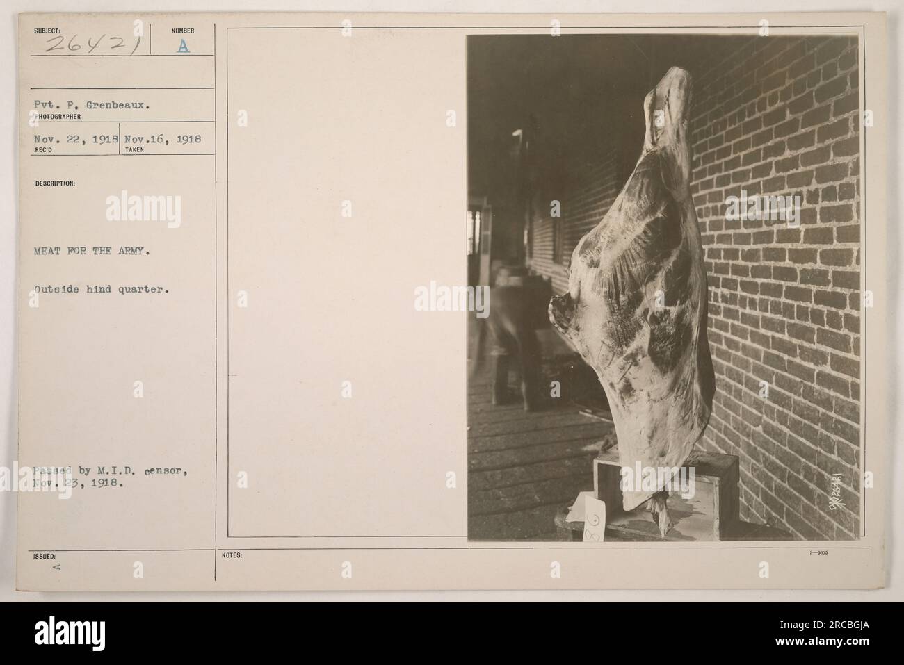 Soldier preparing meat for the army during World War One. The ...