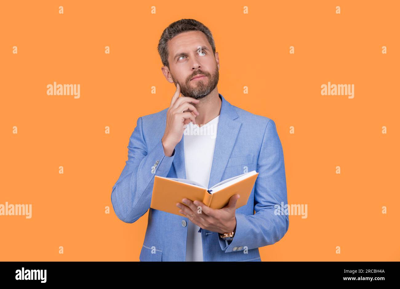 studio shot of thinking man reader reading book. photo of man reader ...