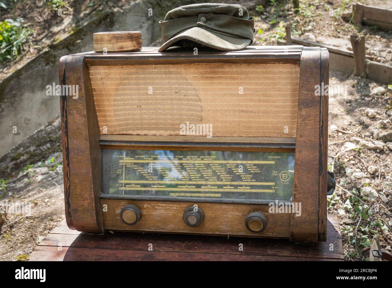 Old WWII brown radio outdoors with a cap on top Stock Photo - Alamy