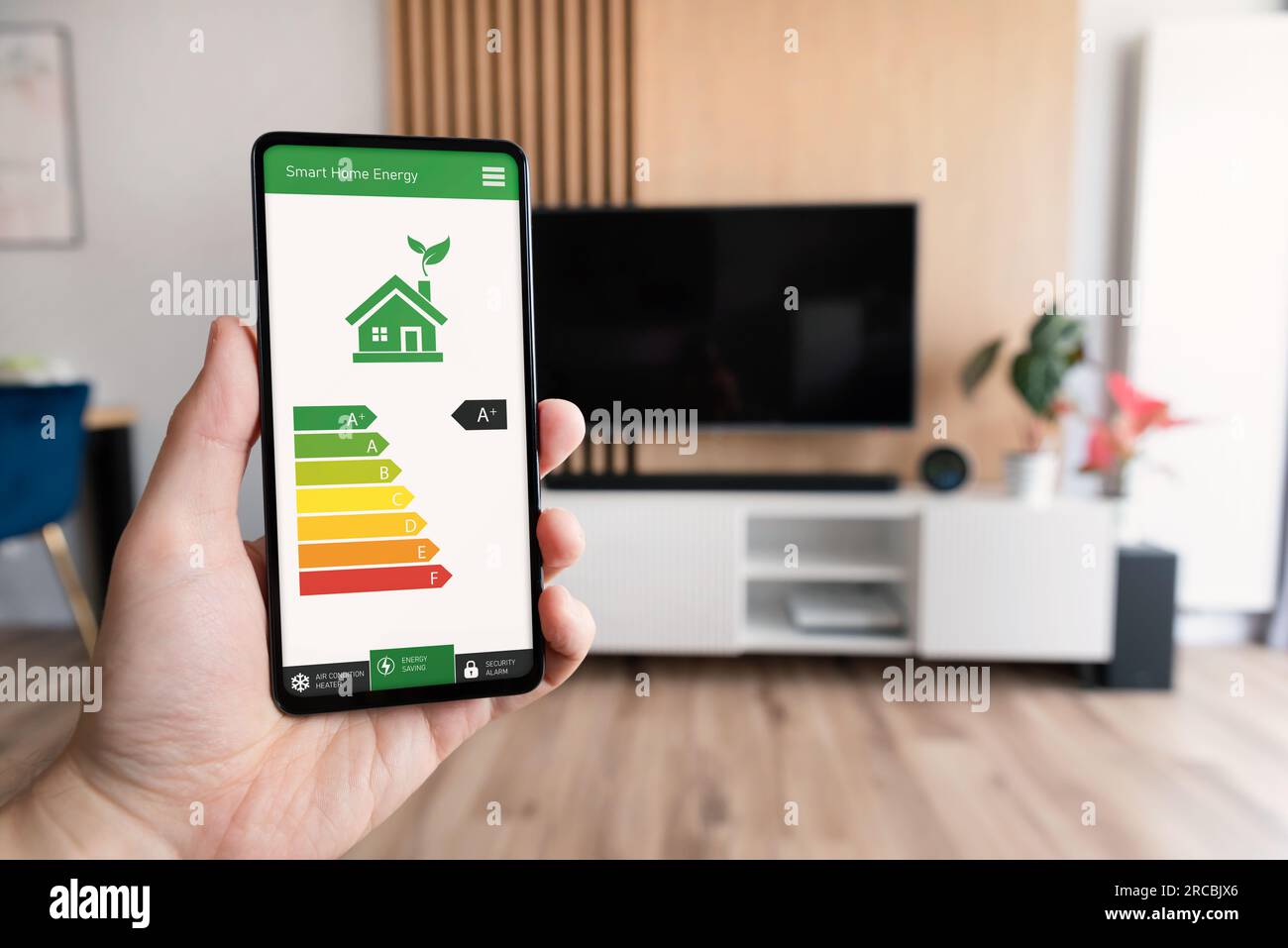 Energy efficiency mobile app on screen, eco smart home Stock Photo - Alamy