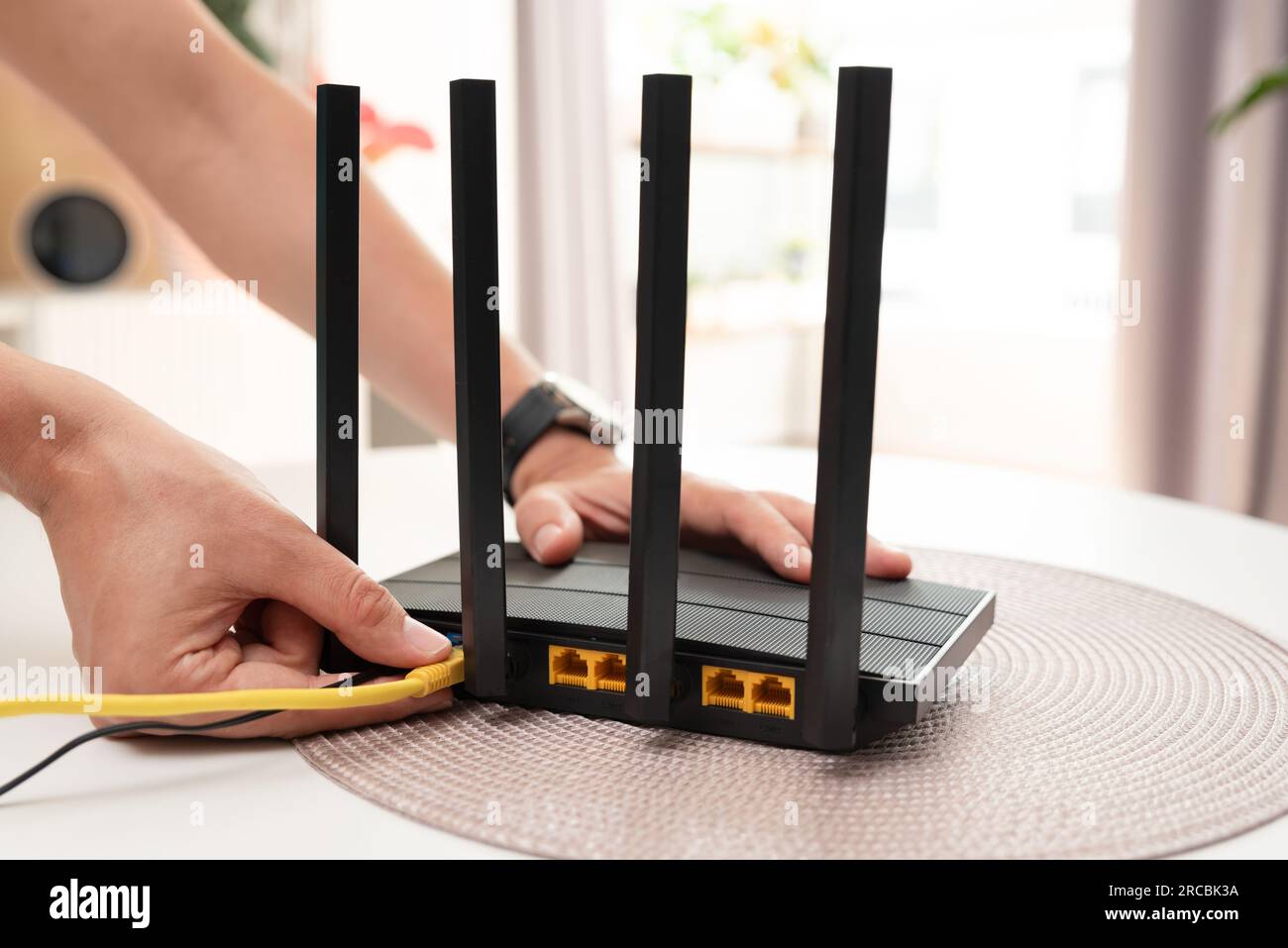 Man using modern wireless router, high speed internet Stock Photo - Alamy