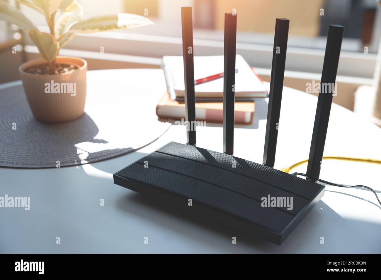 Router with 4 antennas in living room. High speed internet concept ...