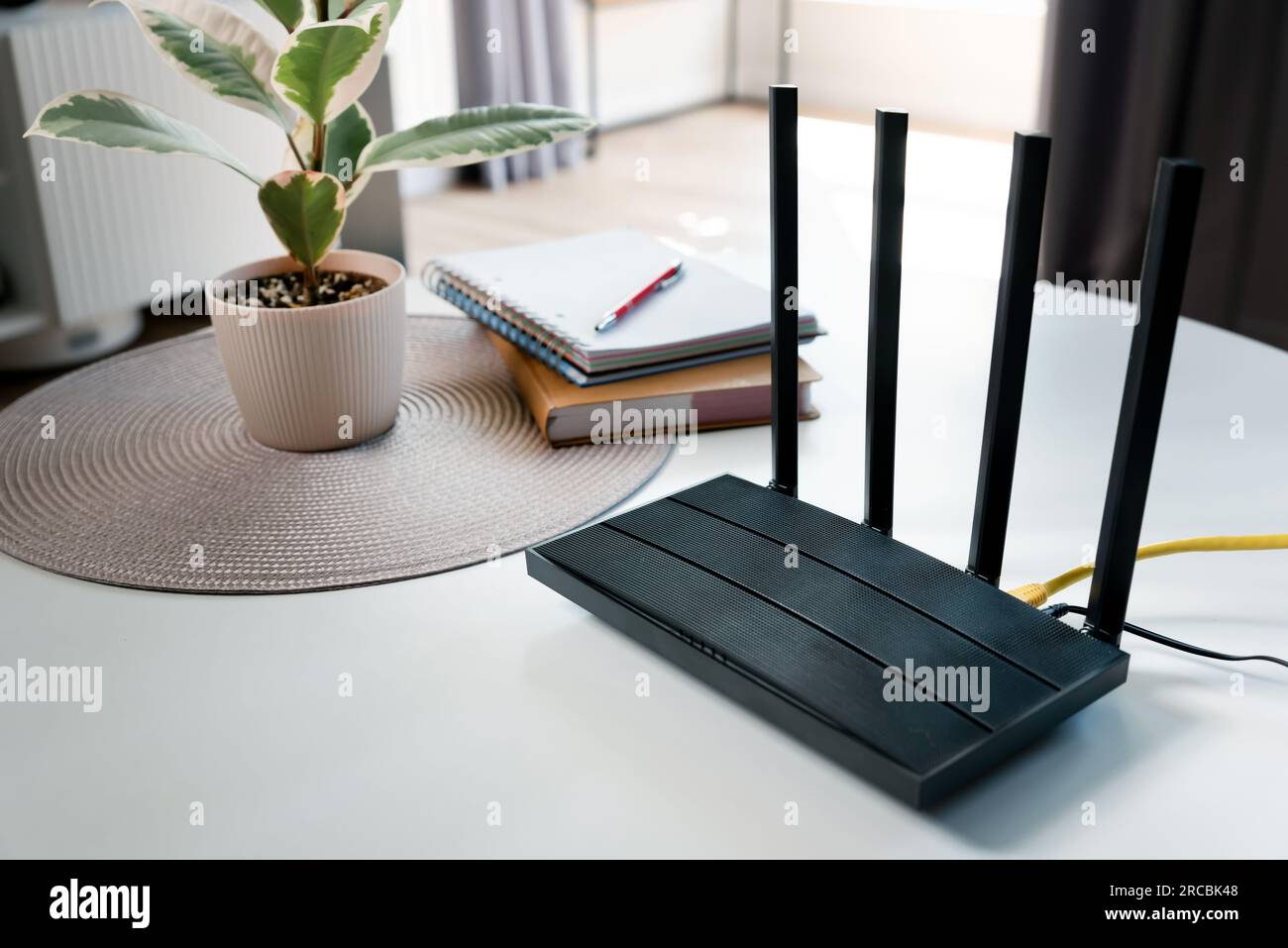 Router with 4 antennas in living room. High speed internet concept ...