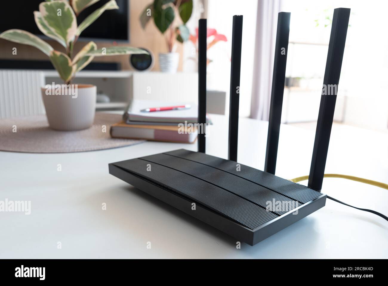 Router with 4 antennas in living room. High speed internet concept ...