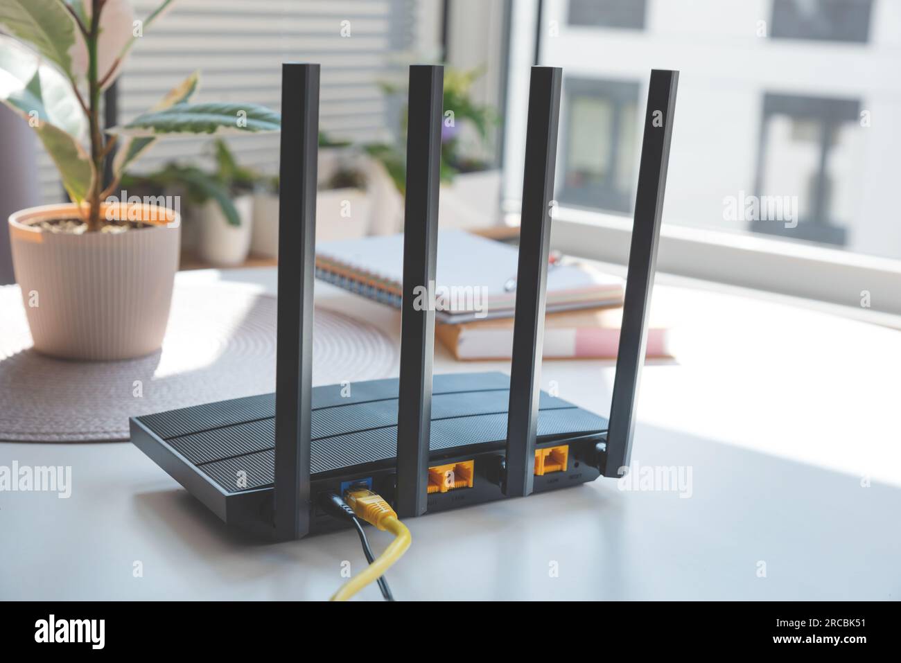 Router with 4 antennas in living room. High speed internet concept ...