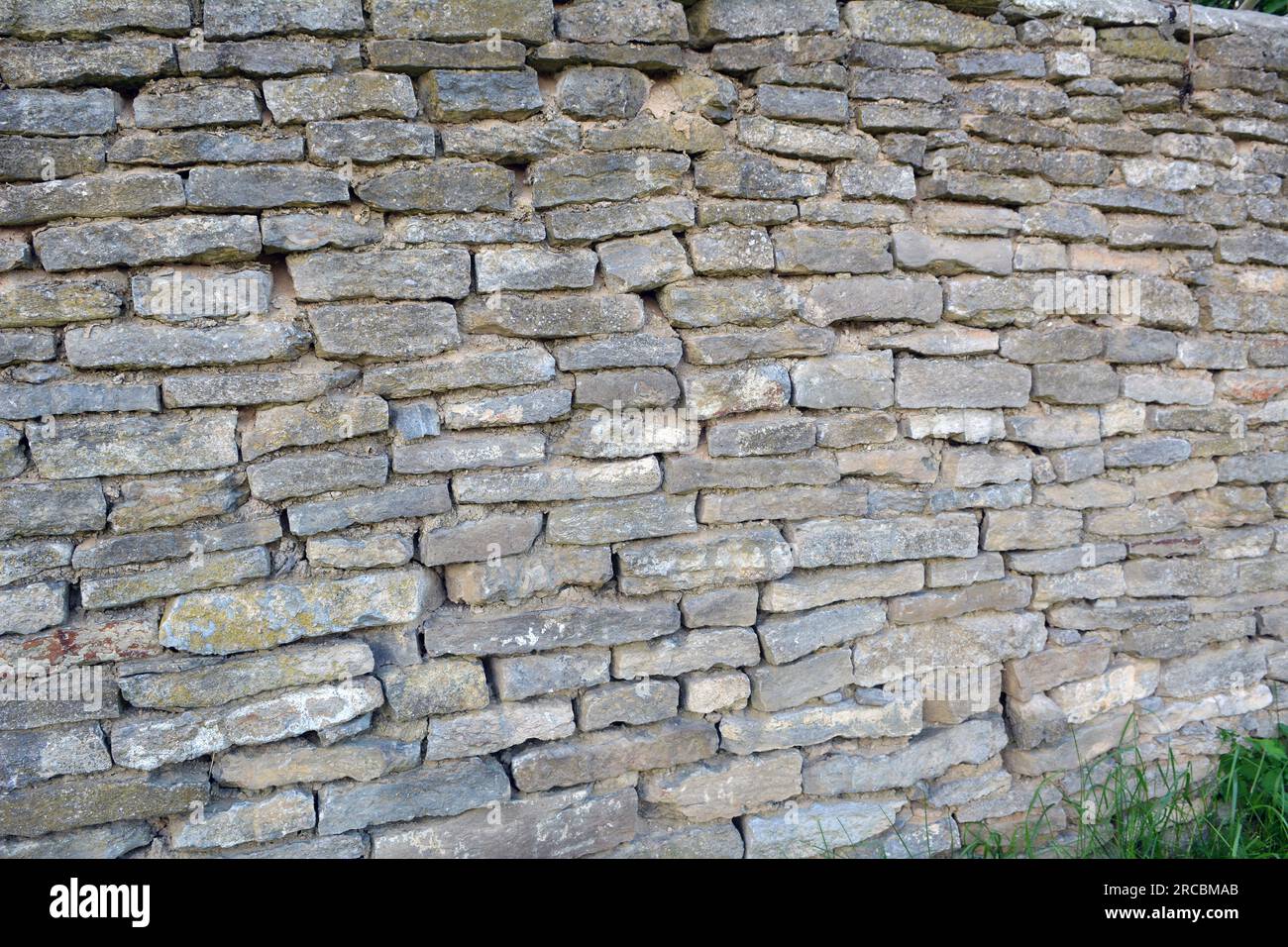 The wall is built of natural stone Stock Photo - Alamy