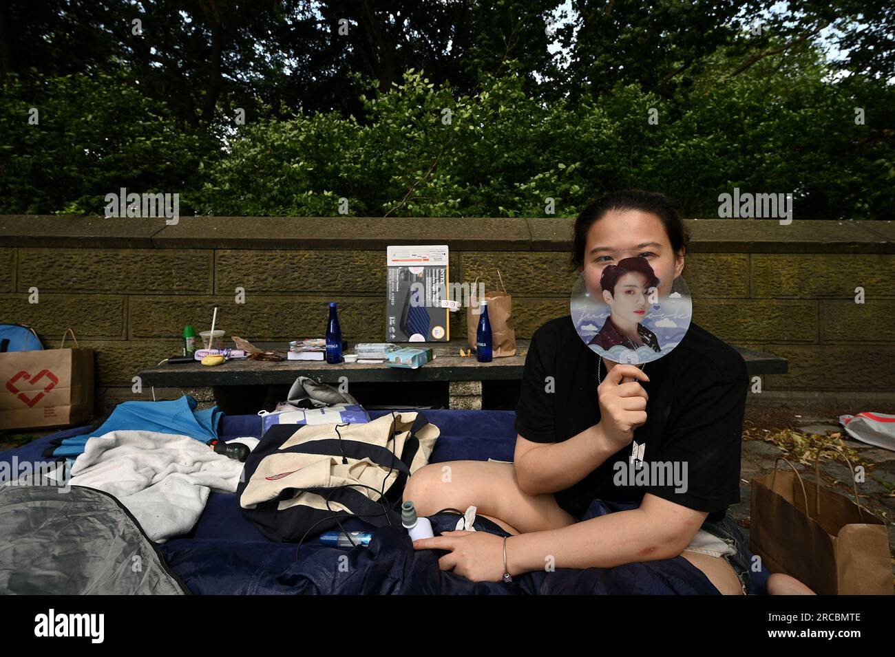 New York, USA. 13th July, 2023. Sitting on an inflatable mattress ...