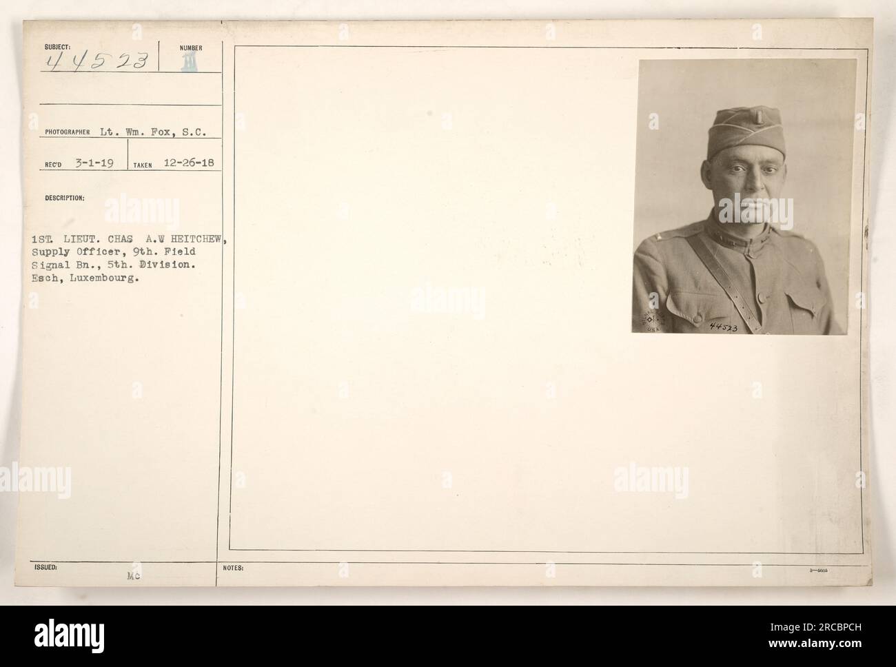 Caption: "Lieutenant Chas A.V. Heitchew, Supply officer of the 9th ...